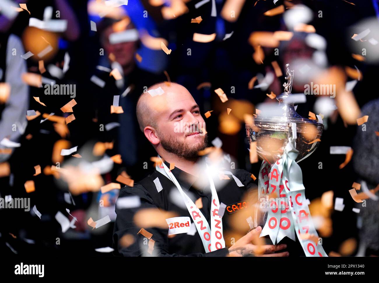 Luca Brecel celebrates with the trophy after beating Mark Selby to win ...