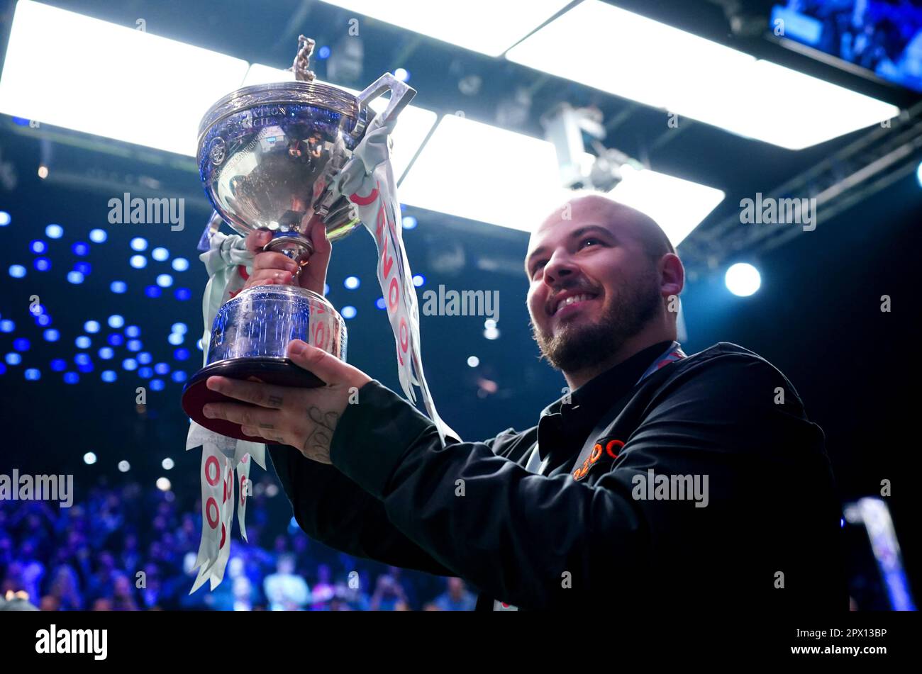 Luca Brecel celebrates with the trophy after beating Mark Selby to win ...