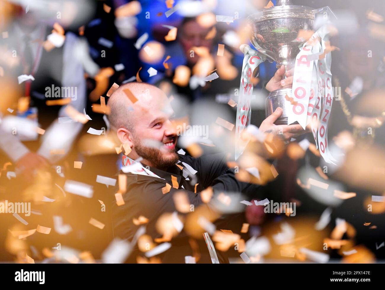 Luca Brecel celebrates with the trophy after beating Mark Selby to win ...