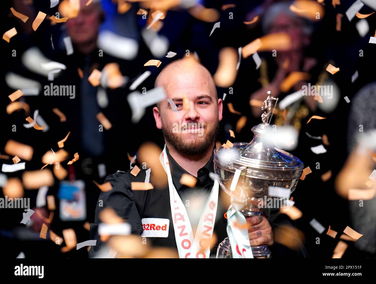 Luca Brecel celebrates with the trophy after beating Mark Selby to win ...