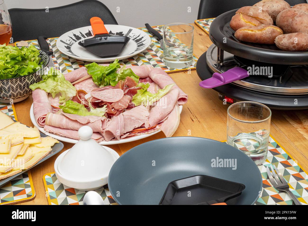 Raclette cheese and meat, a french tradition Stock Photo - Alamy