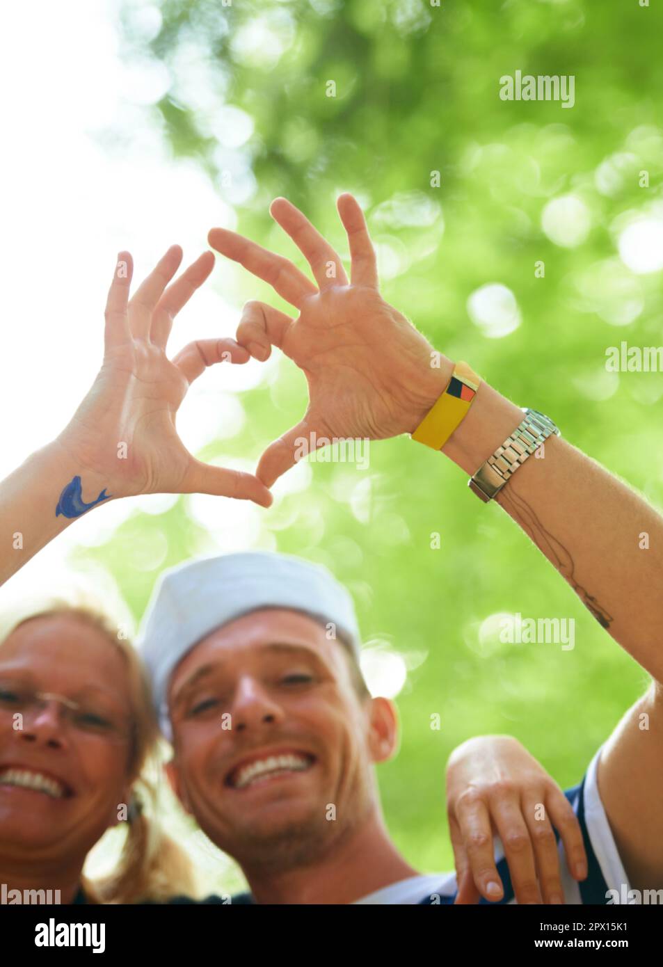 People making hearts with their hands hi-res stock photography and ...