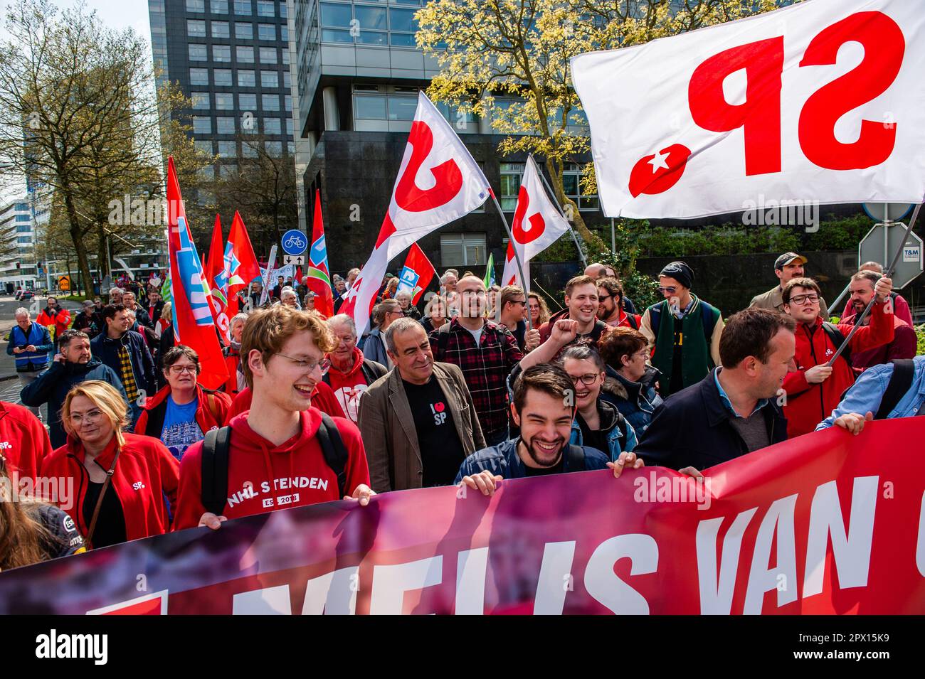 People from the political party SP are sen walking with flags and ...