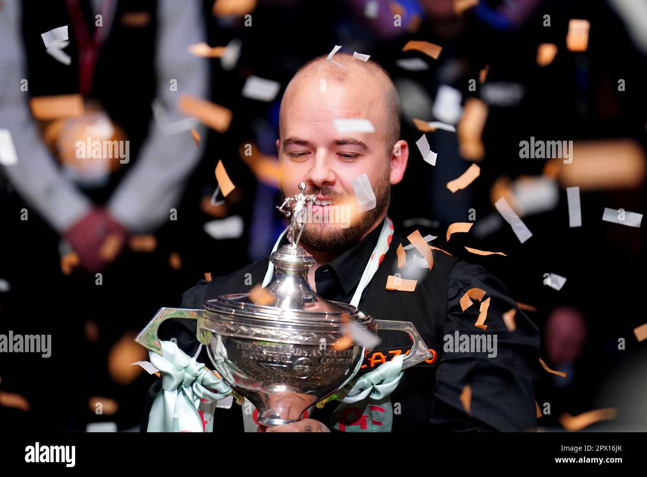 Luca Brecel celebrates with the trophy after beating Mark Selby to win ...