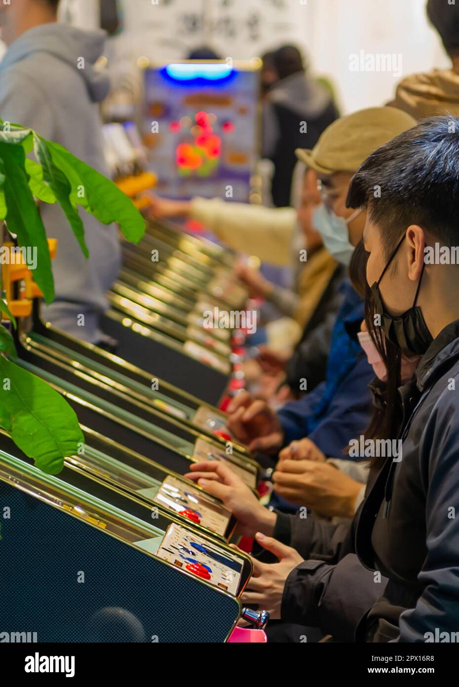 Concentrating on electronic games at Ningxia Night Market, Taipei ...