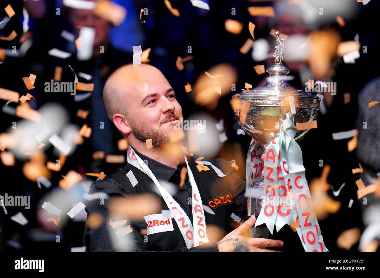 Luca Brecel celebrates with the trophy after beating Mark Selby to win ...