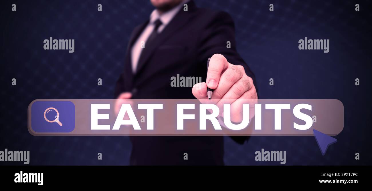 Hand writing sign Eat Fruits, Concept meaning consume any product of ...