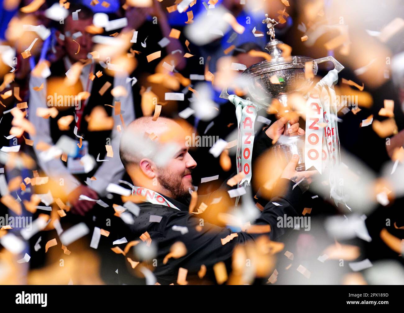 Luca Brecel celebrates with the trophy after beating Mark Selby to win ...