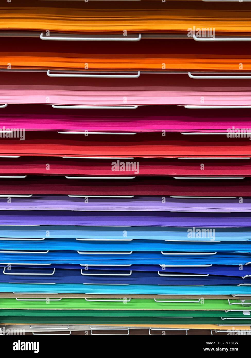 closeup front view of many various art colored paper cardboard canvas ...