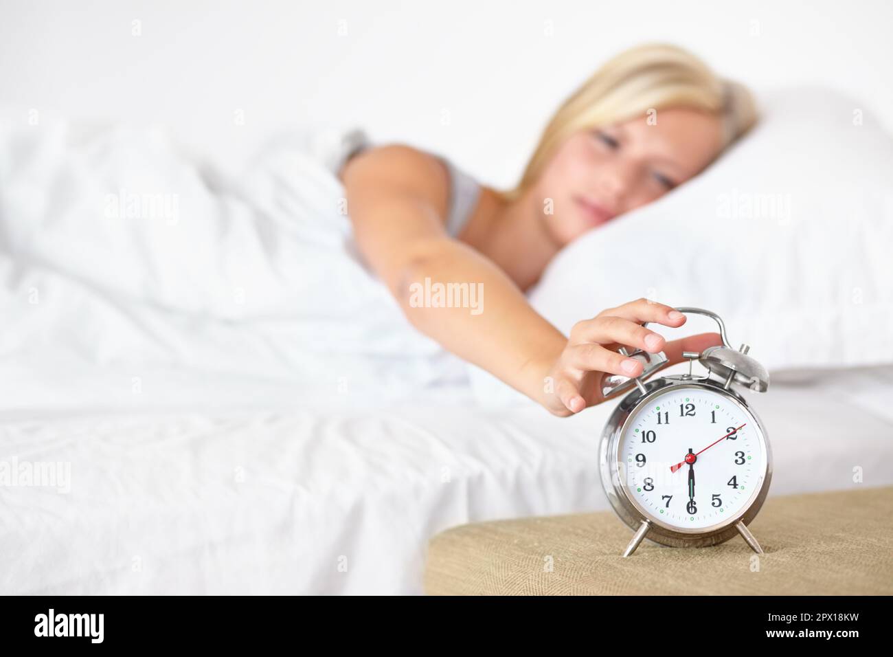 Woman alarm clocks bed hi-res stock photography and images - Alamy