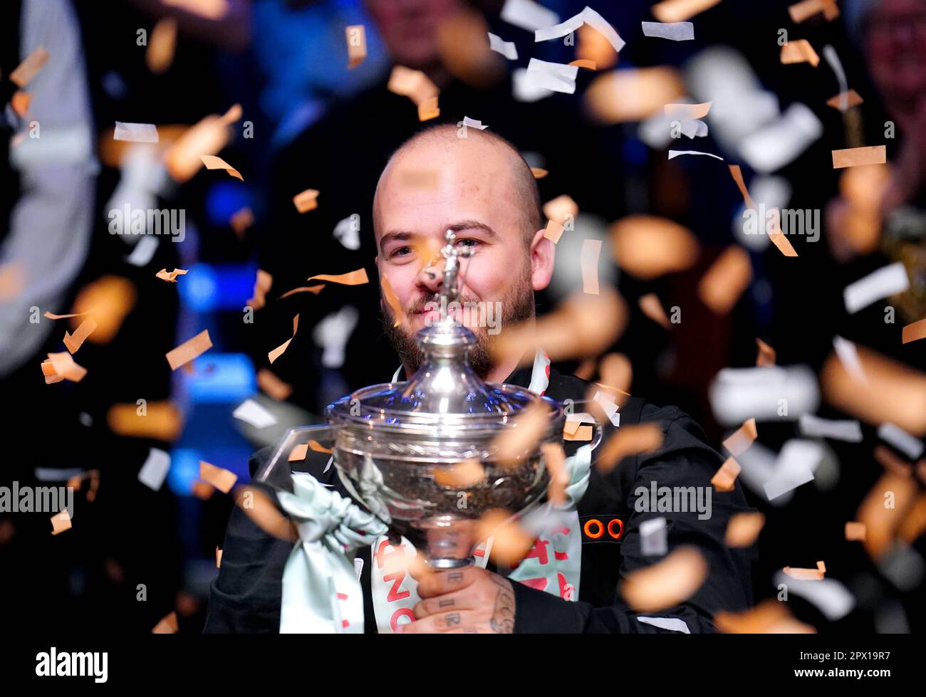 Luca Brecel celebrates with the trophy after beating Mark Selby to win ...