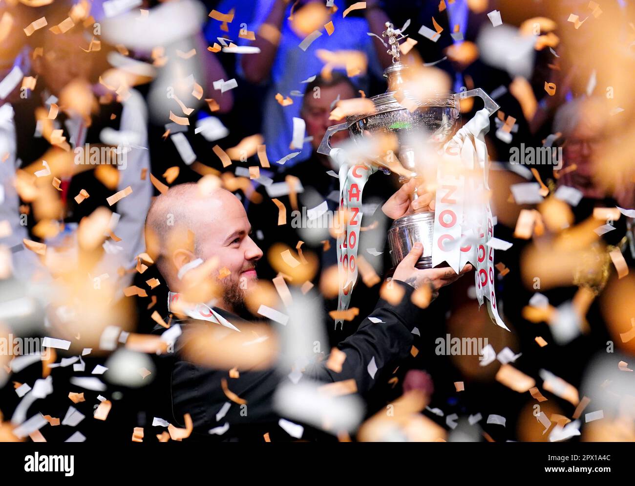 Luca Brecel celebrates with the trophy after beating Mark Selby to win ...