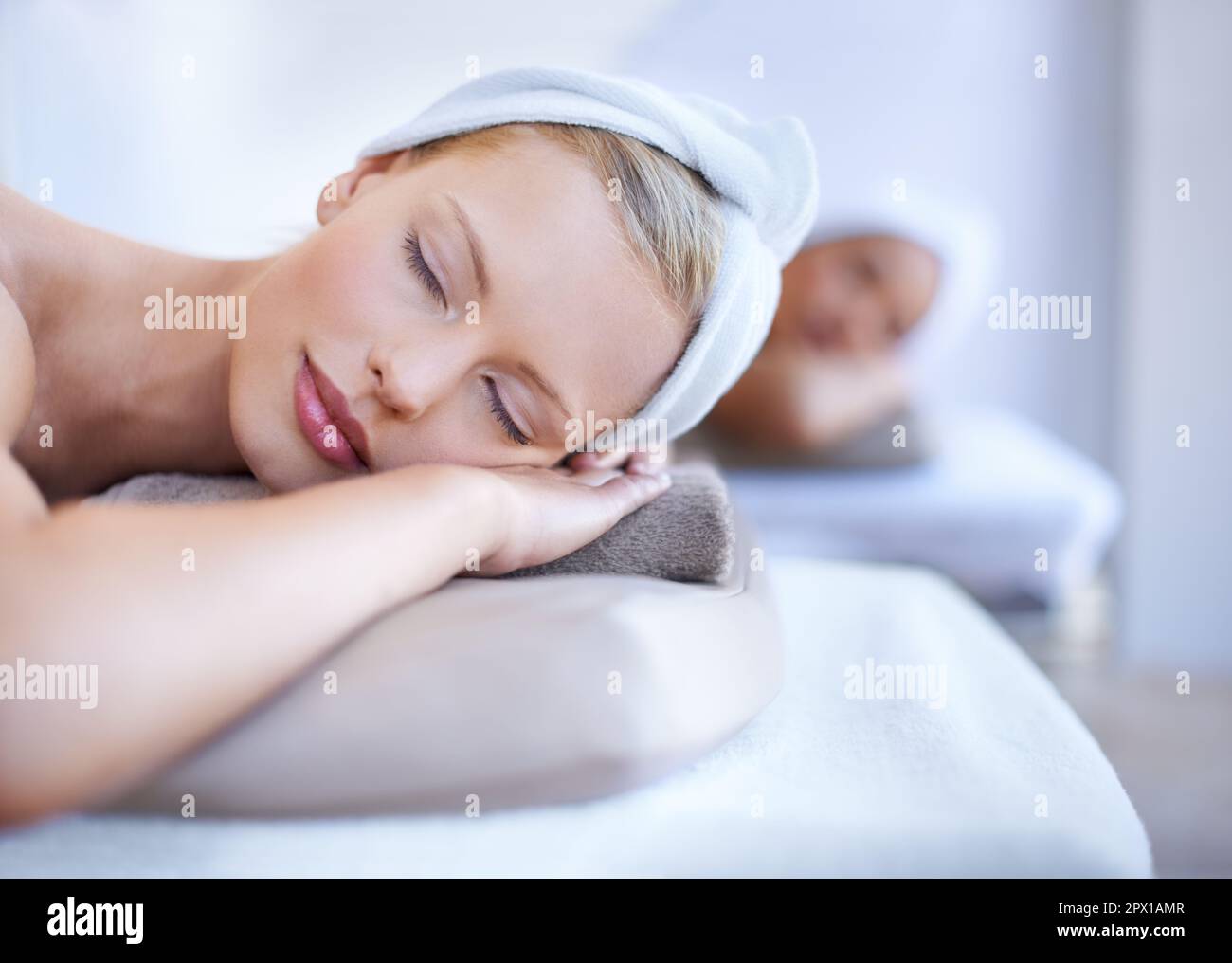 Shes ready to be pampered. An attractive young woman relaxing at the ...