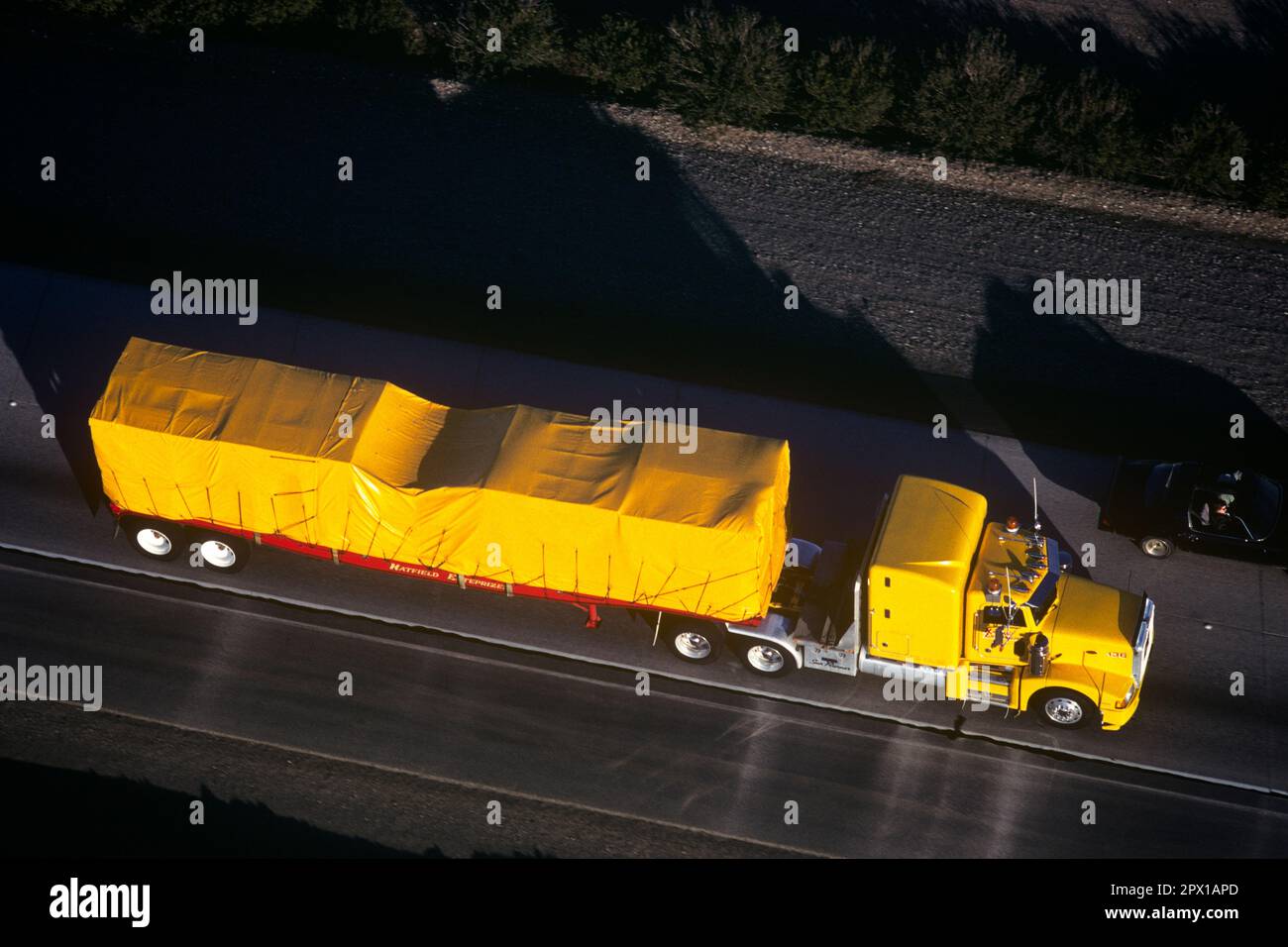 1980s OVERHEAD VIEW OF TRACTOR TRAILER CARGO COVERED WITH YELLOW TARP ...