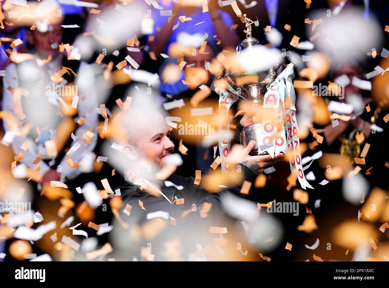 Luca Brecel celebrates with the trophy after beating Mark Selby to win ...
