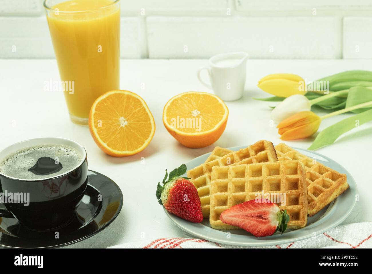 Belgian waffles and fresh fruit for breakfast. Fresh orange juice and ...