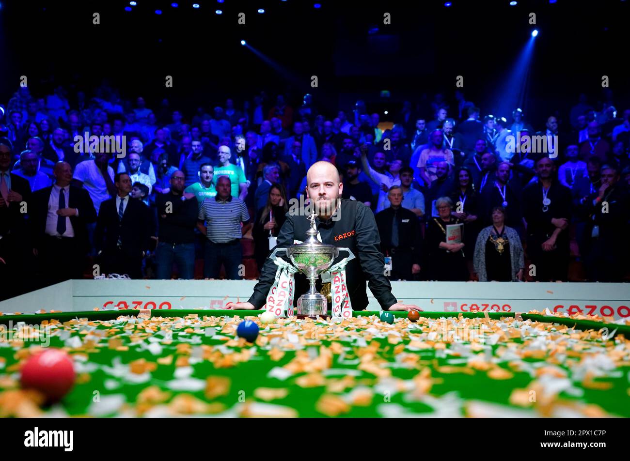 Luca Brecel celebrates with the trophy after beating Mark Selby to win ...