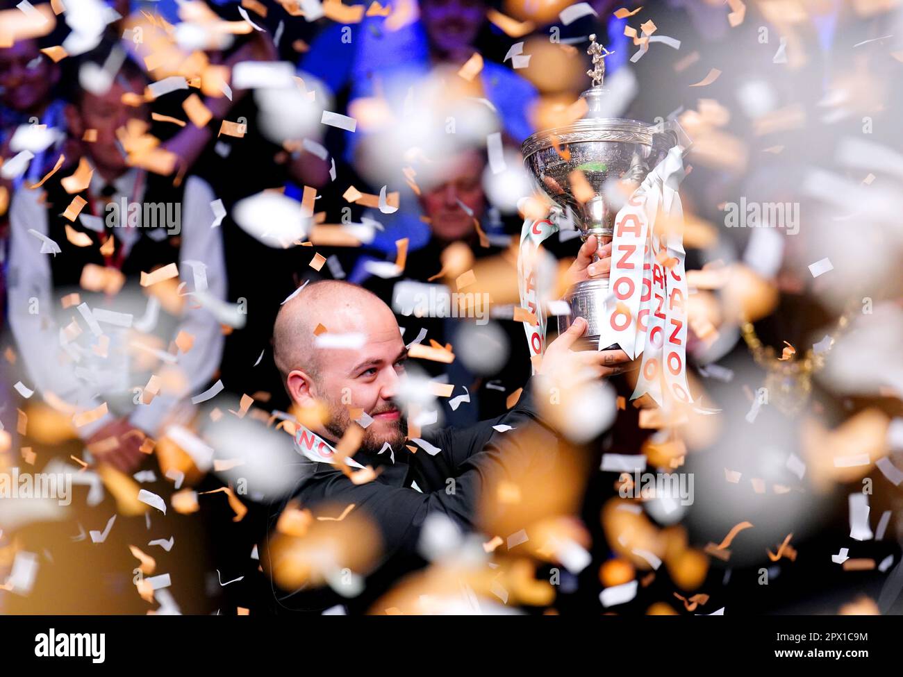 Luca Brecel celebrates with the trophy after beating Mark Selby to win ...