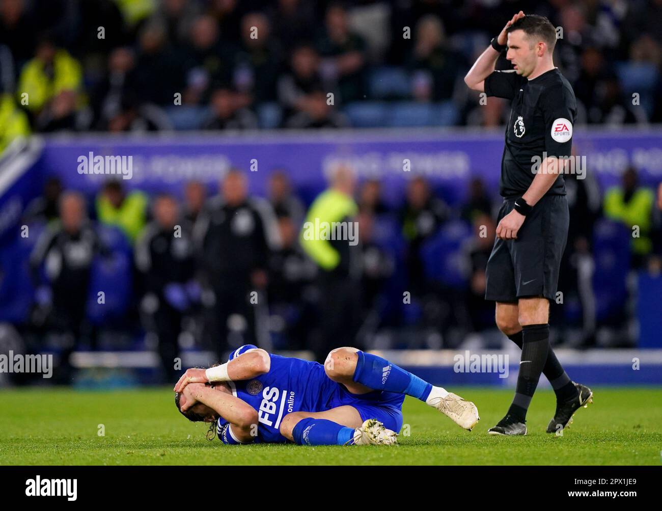 Leicester City's Caglar Soyuncu goes down injured during the Premier ...