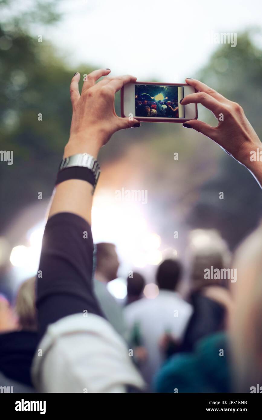 Capturing the awesome moment. A person taking a picture of their ...