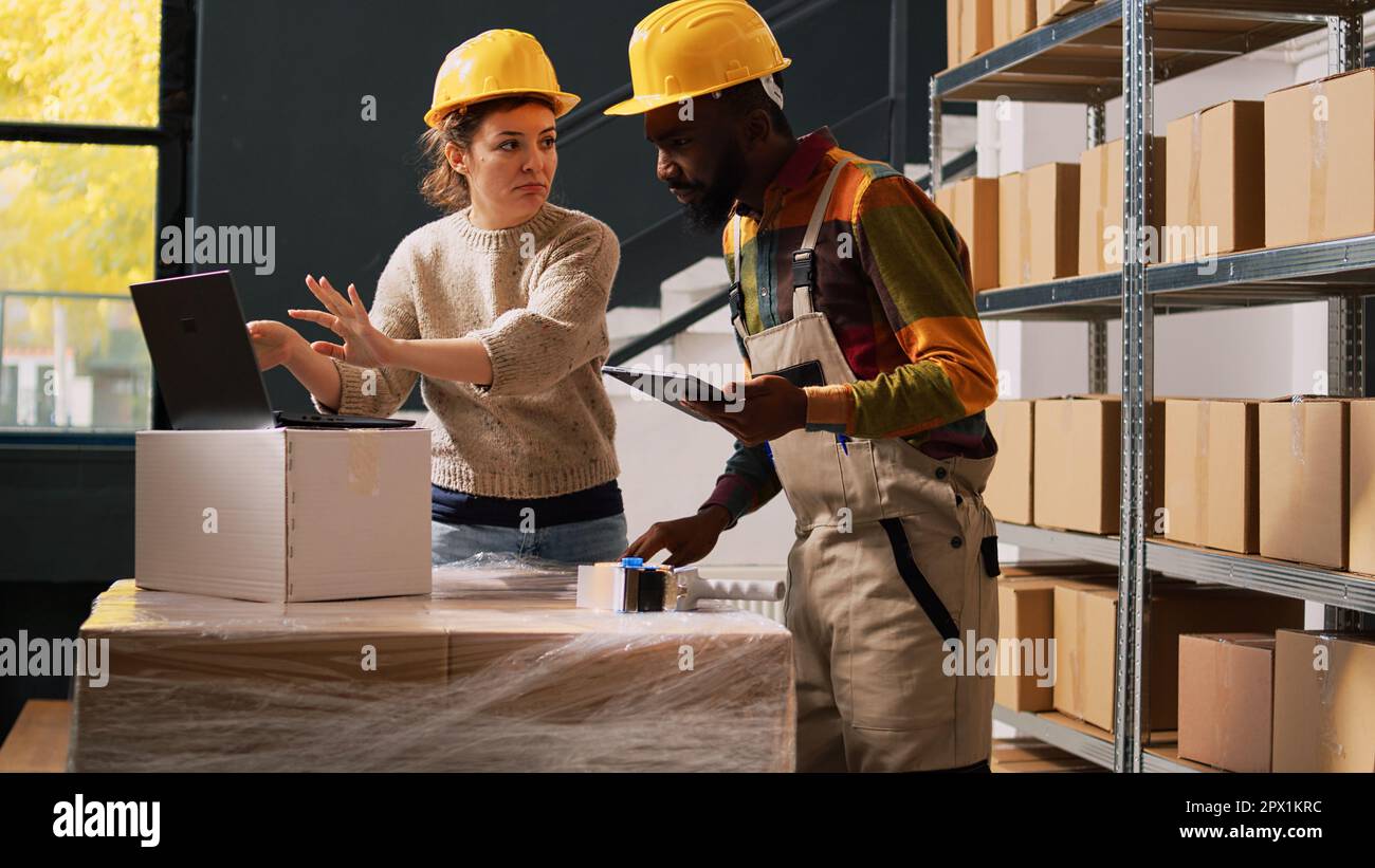 Team of workers analyzing logistics for merchandise production in ...