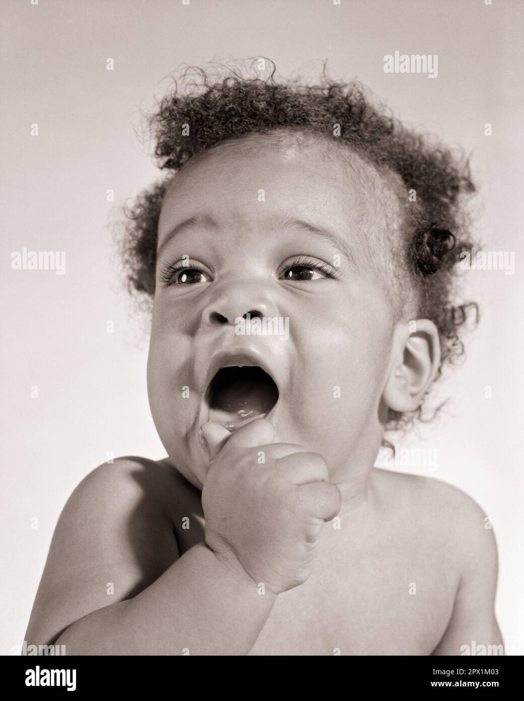 1960s LAUGHING AFRICAN-AMERICAN BABY BOY CAUGHT IN AN EXPRESSION OF ...