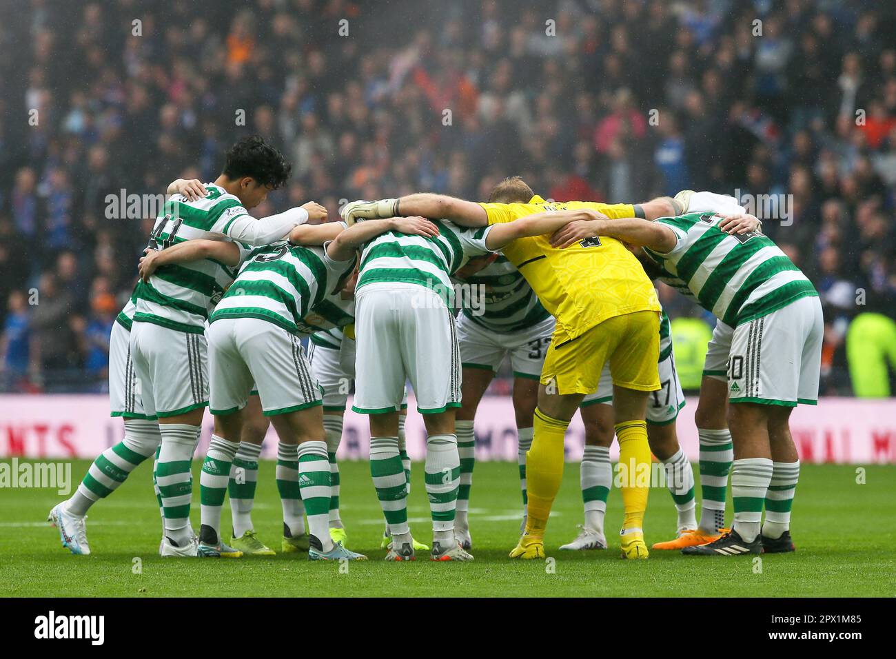 Celtic team in their regular team huddle as a pre- match routine, Taken at Hampden Park, Glasgow ...