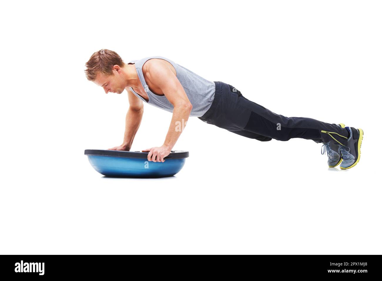 Building his upper body strength. A young man working his upper body ...