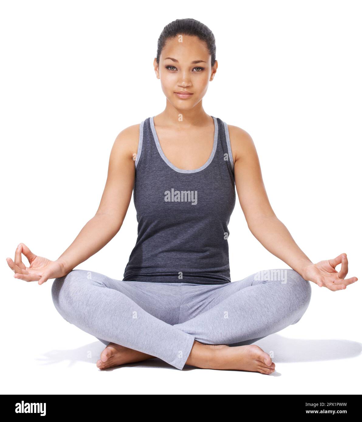 Good posture is the backbone of health. A beautiful young woman doing a ...