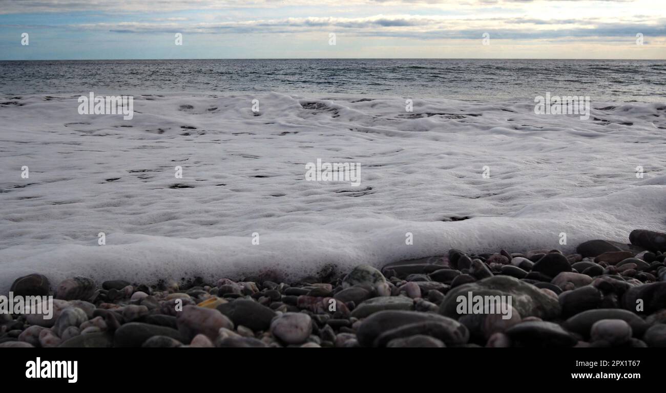 Moving along pebble beach waves hi-res stock photography and images - Alamy