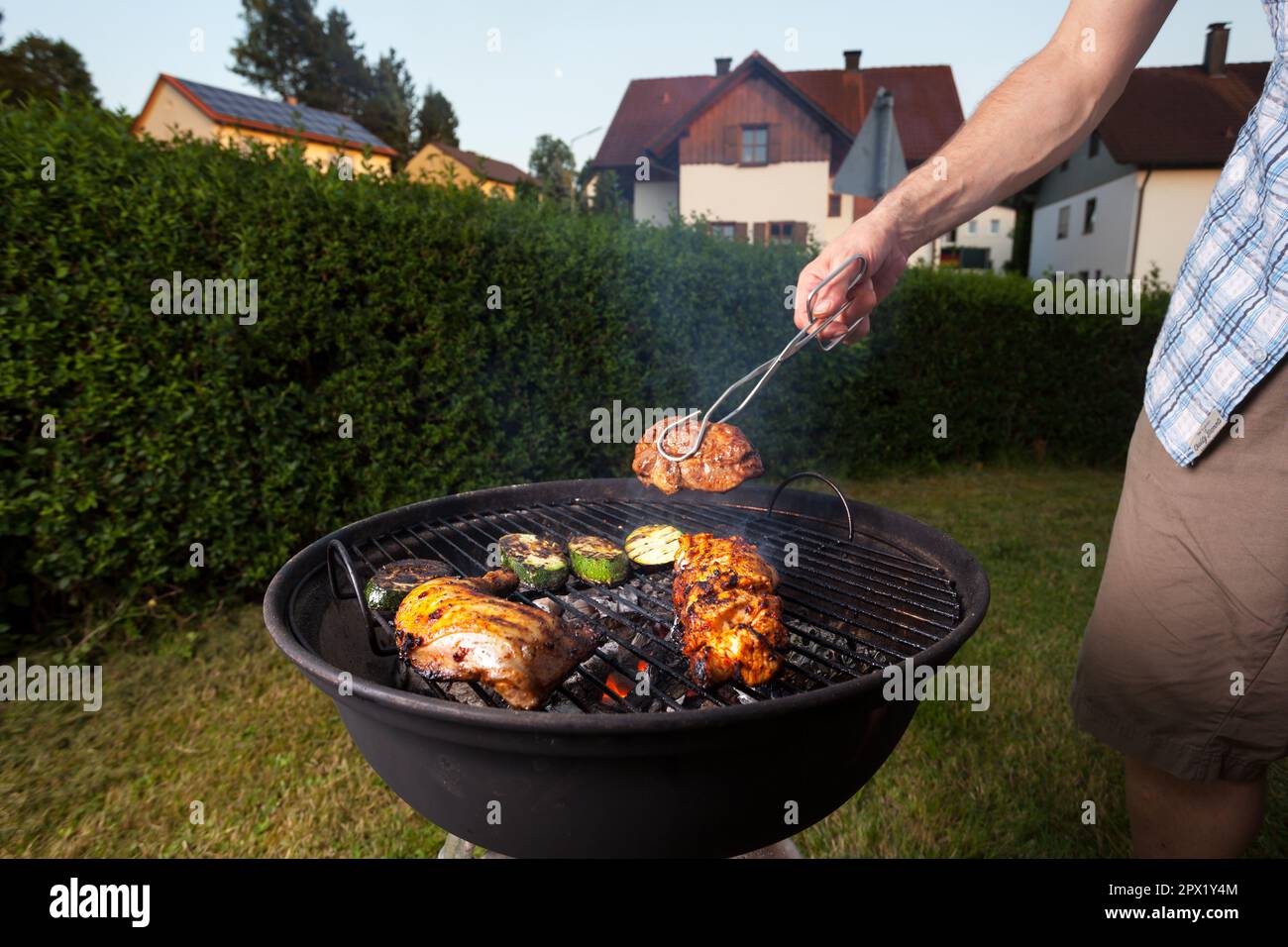 grill cooking out in the backyard Stock Photo - Alamy