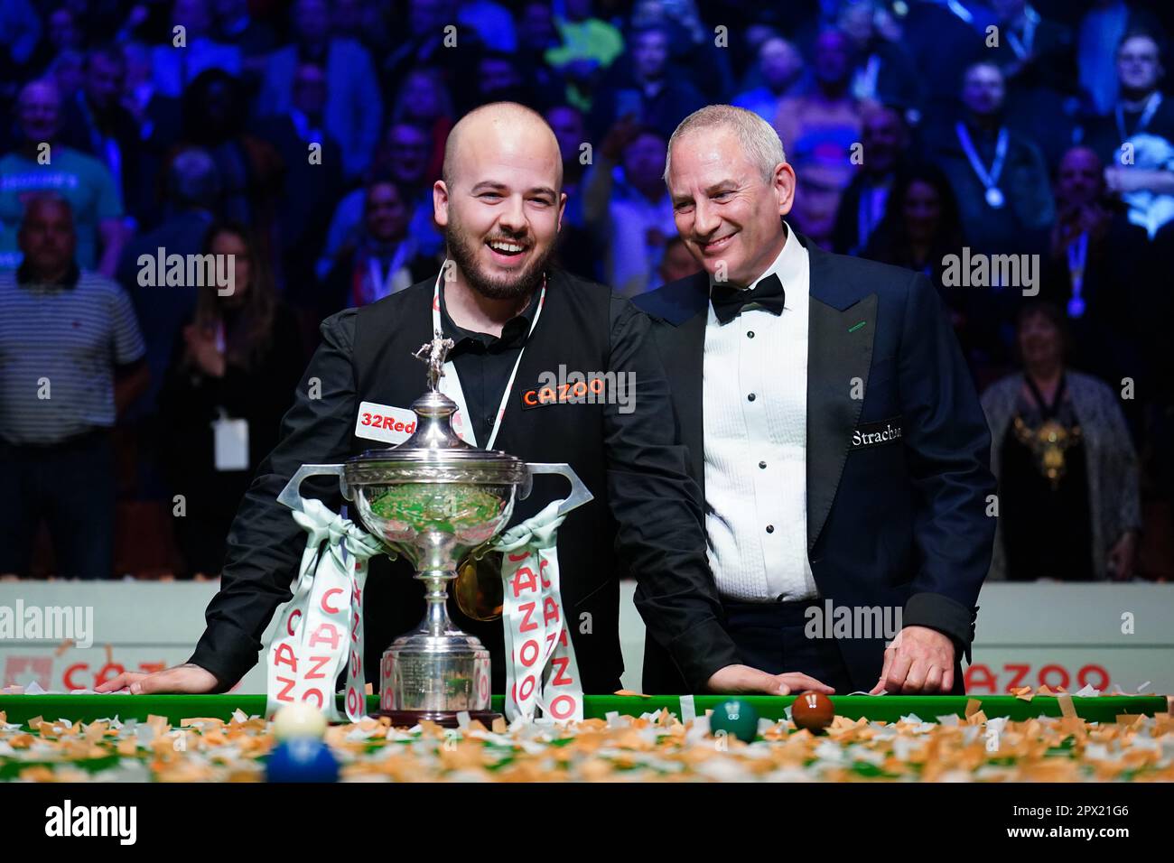 Luca Brecel celebrates with Brendan Moore (right) after winning the ...