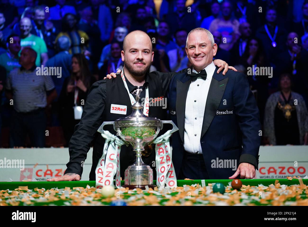 Luca Brecel celebrates with Brendan Moore (right) after winning the ...
