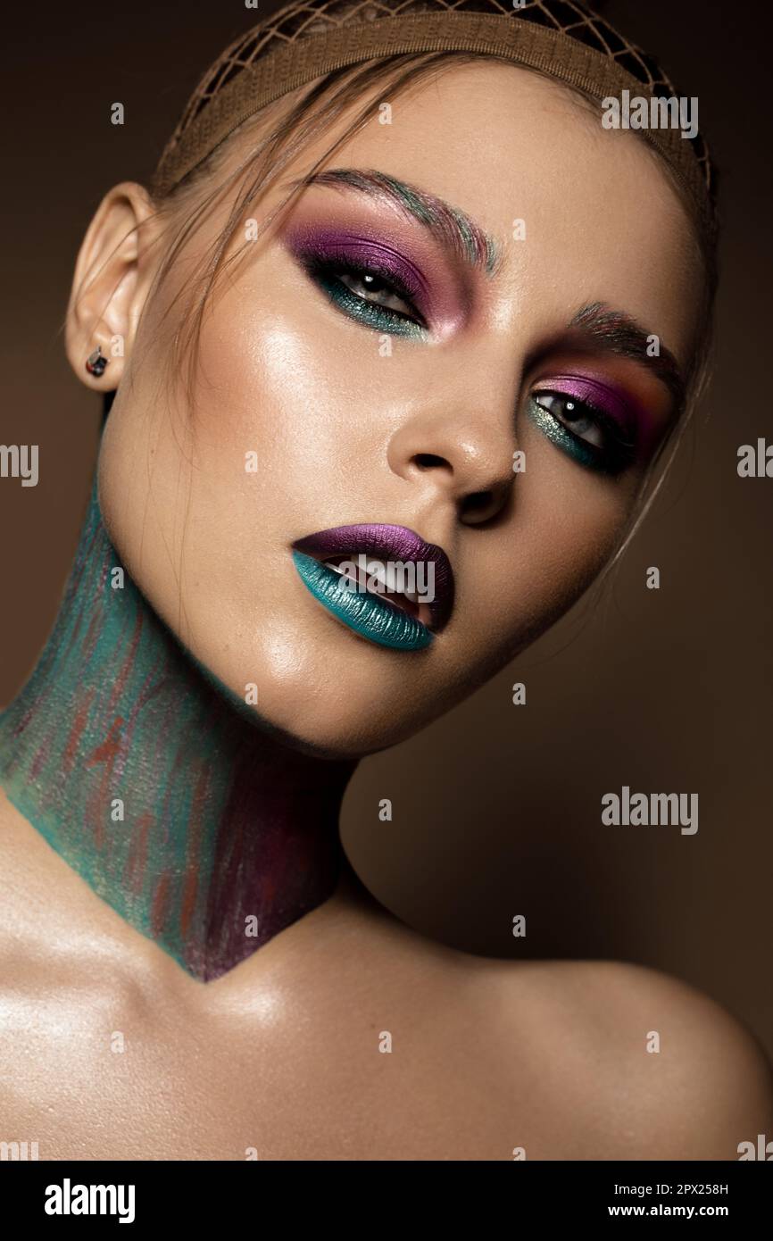 Beautiful girl with creative colorful makeup. Beauty face. Photos shot ...
