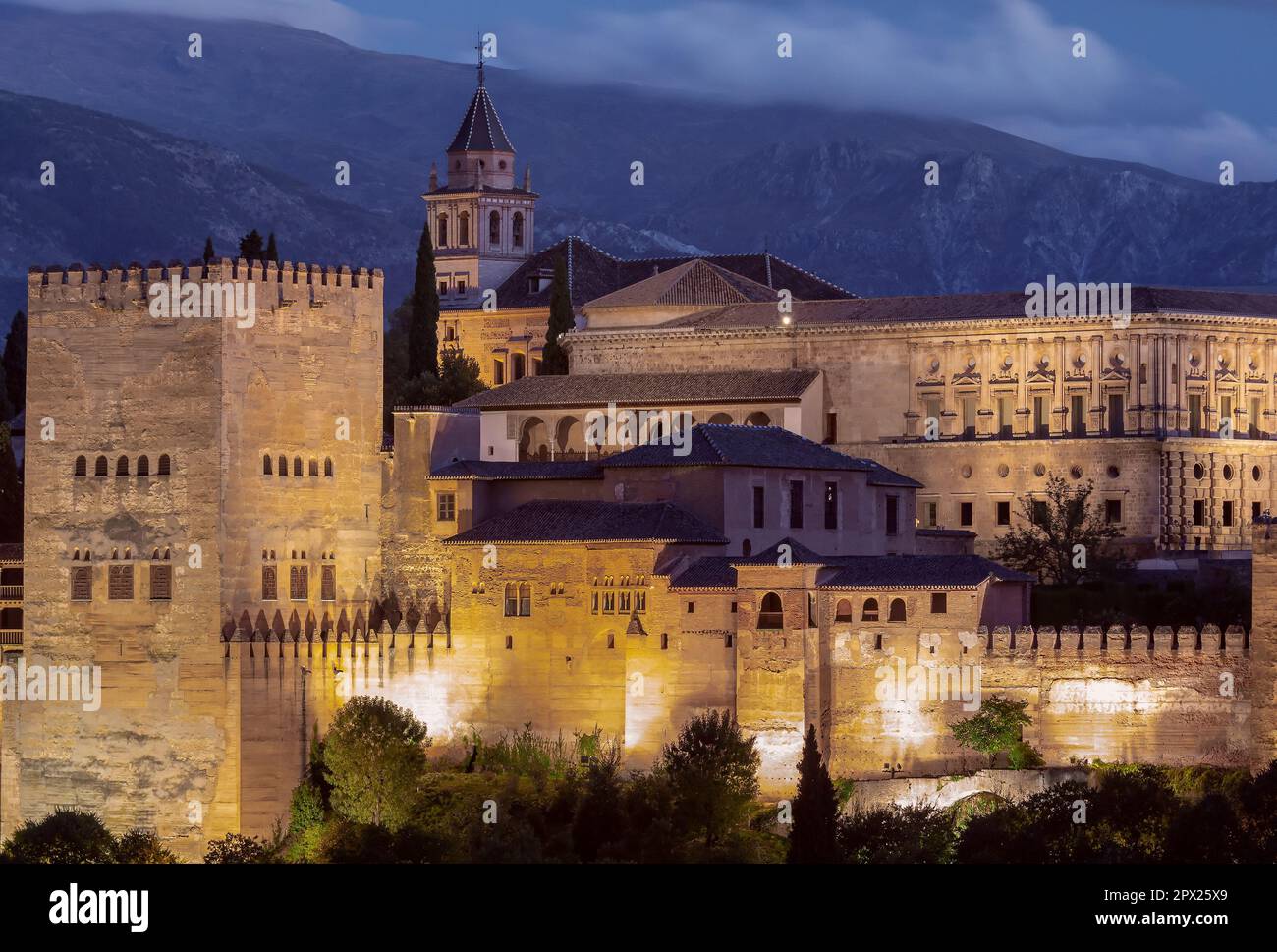 Fortifications in the ancient Alhambra palace complex at sunset ...