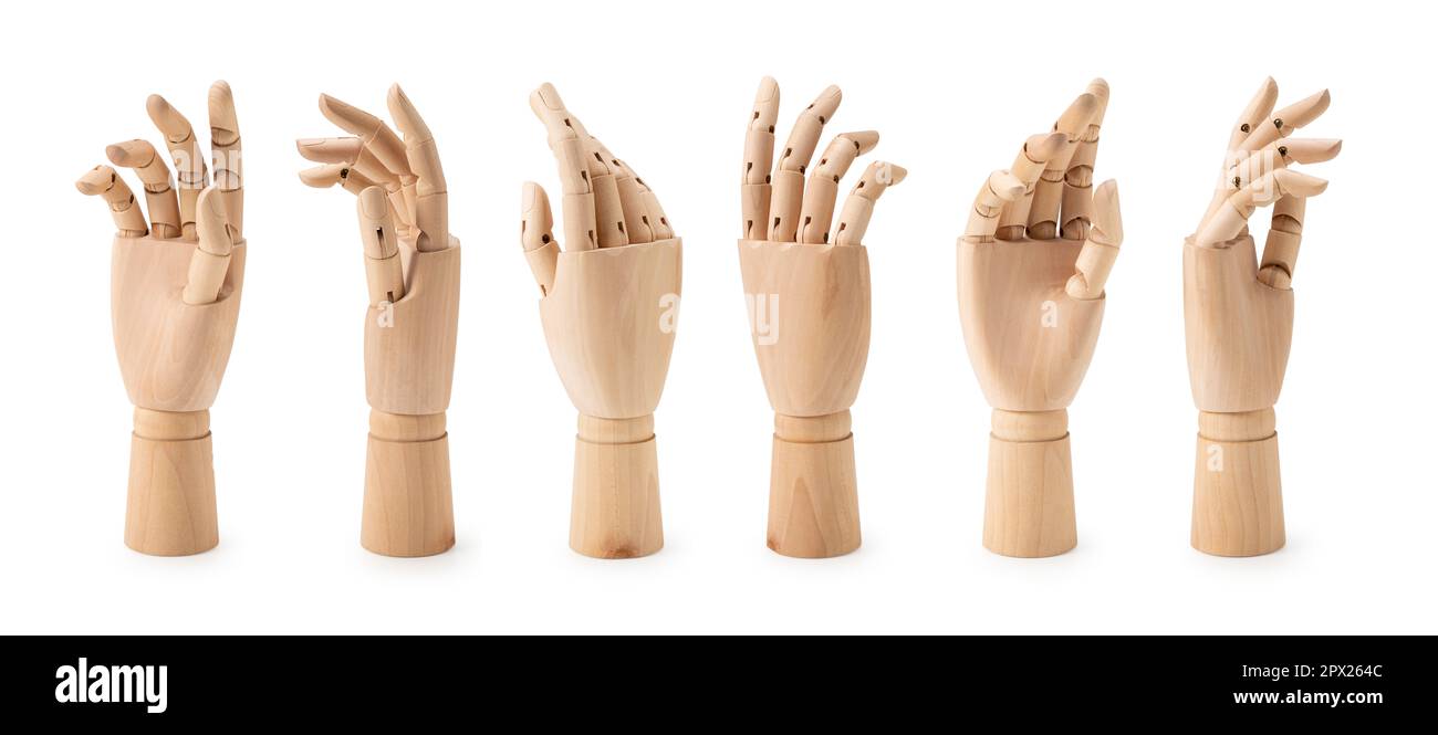 Wooden mannequin hands placed on white background. Different angles ...