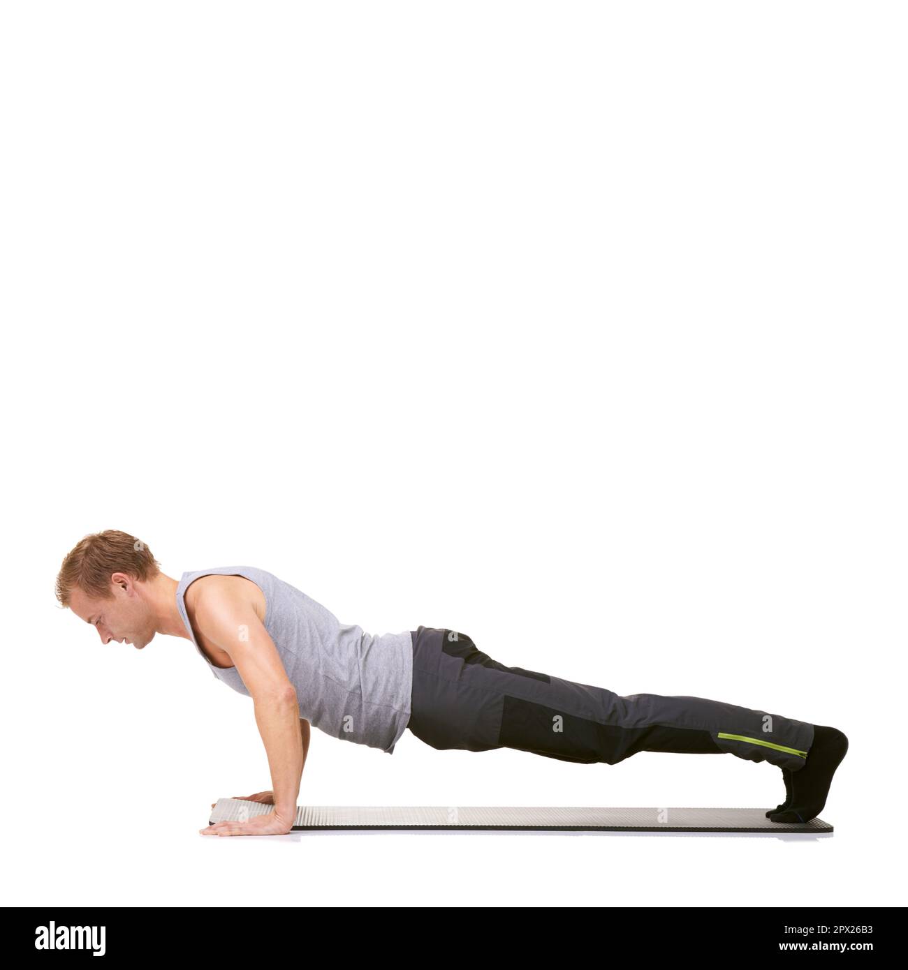 Strength and determination - Fitness. A fit young man doing push-ups on ...