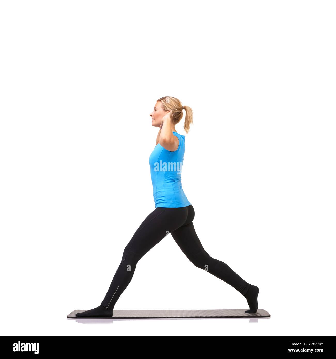 Keeping her balance takes strength. A young woman performing a routine ...