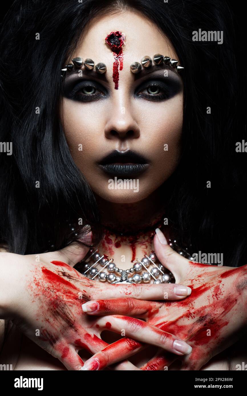 Demon girl with a bullet in the head and her throat cut. An image for ...