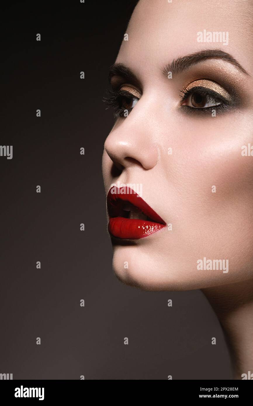 Portrait of beautiful girl with red lips. Picture taken in the studio ...