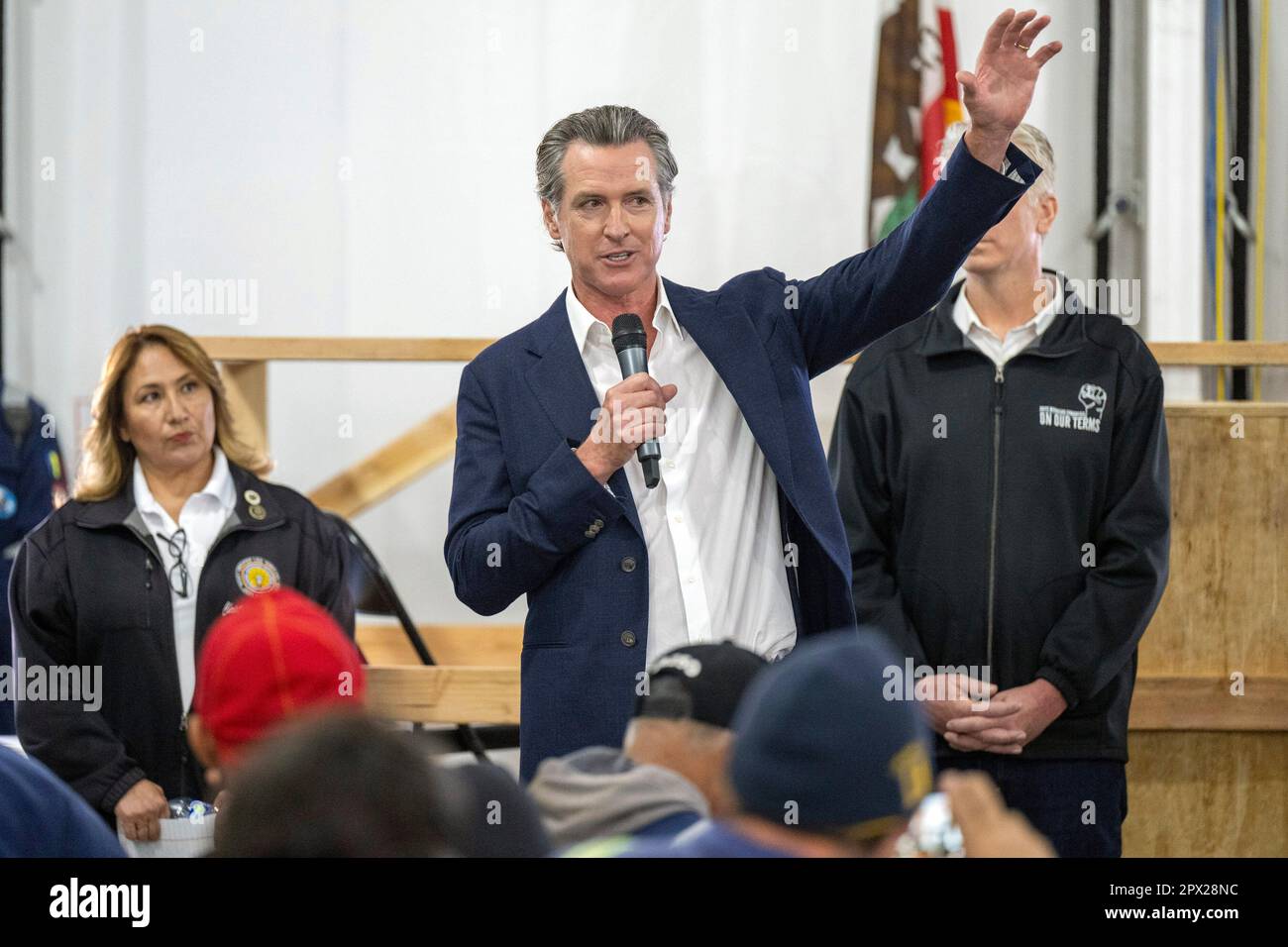 California Gov. Gavin Newsom talks with workers during a stop at World ...