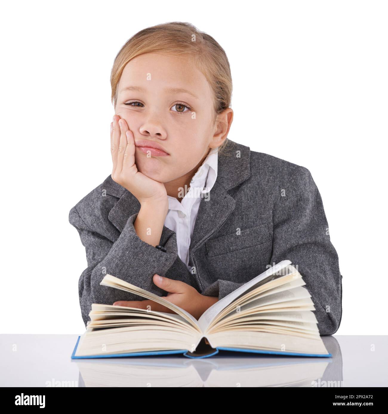 When is class finished. Adorable young girl sitting and looking bored ...