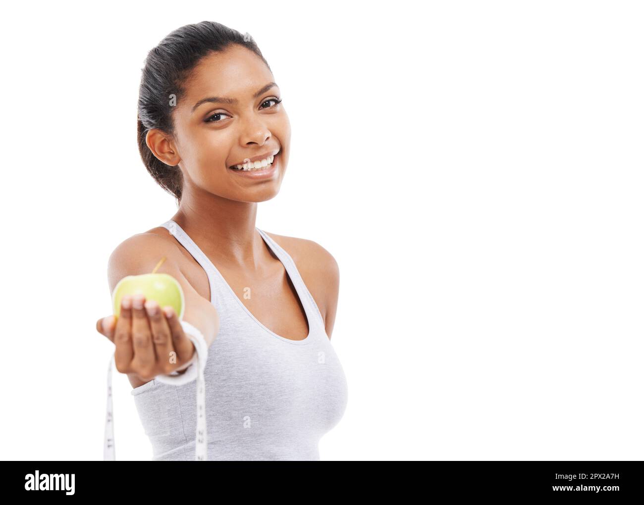 Choose the healthy alternative. A pretty young woman offering you an ...