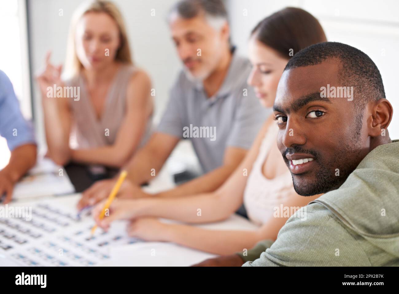 They work well together. An african american man glancing over his ...