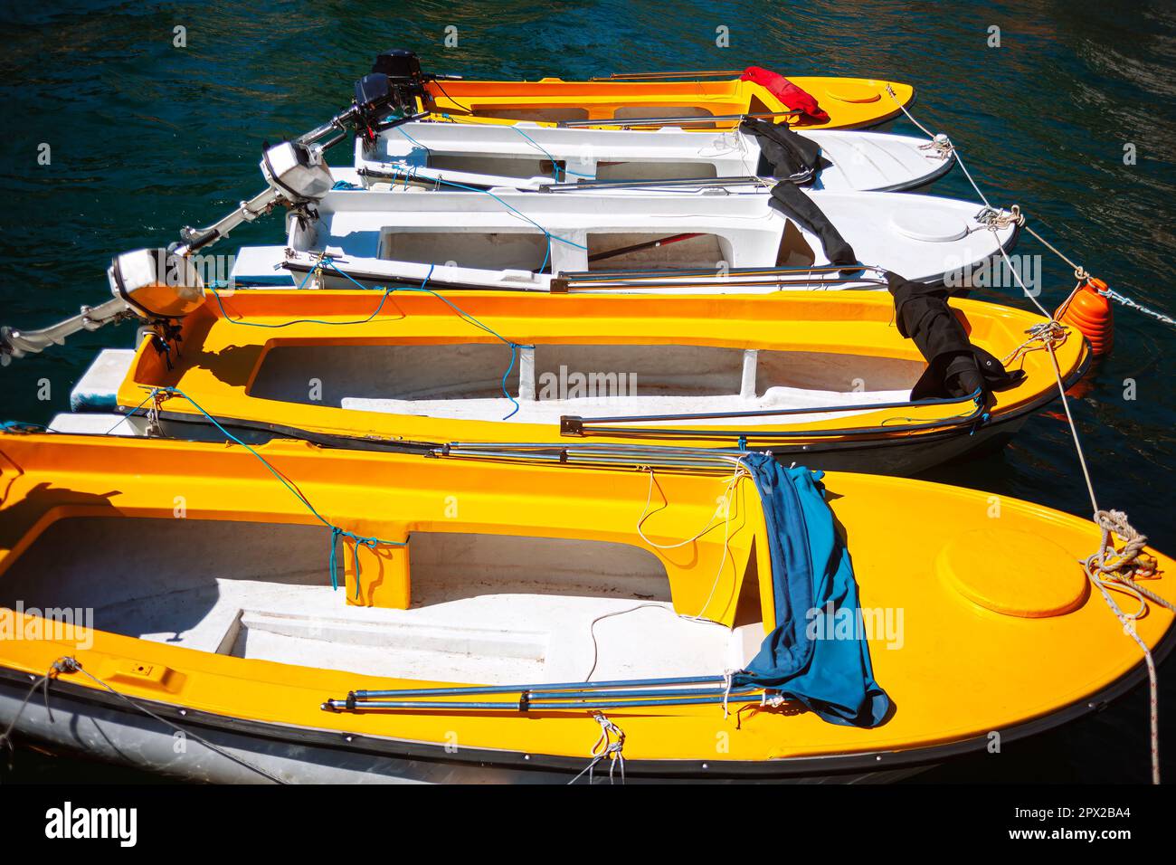 Harbor with yellow boats . Fishing boats in a row Stock Photo - Alamy