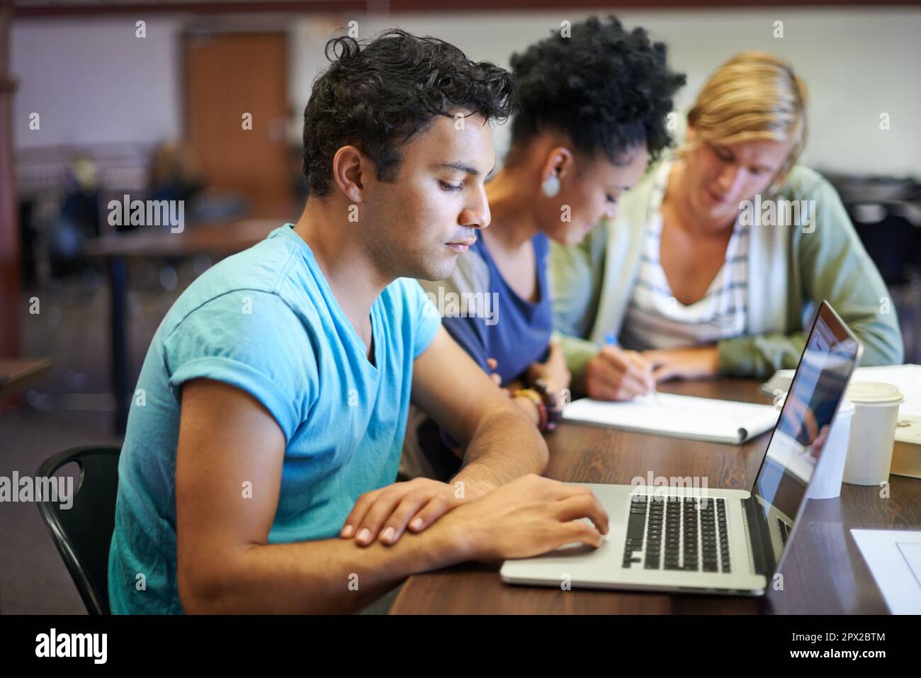 Working together to prepare for finals. A group of young people ...