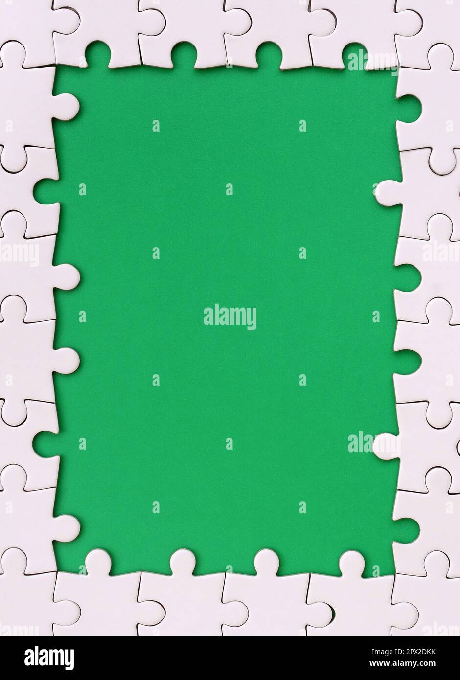 Framing in the form of a rectangle, made of a white jigsaw puzzle ...