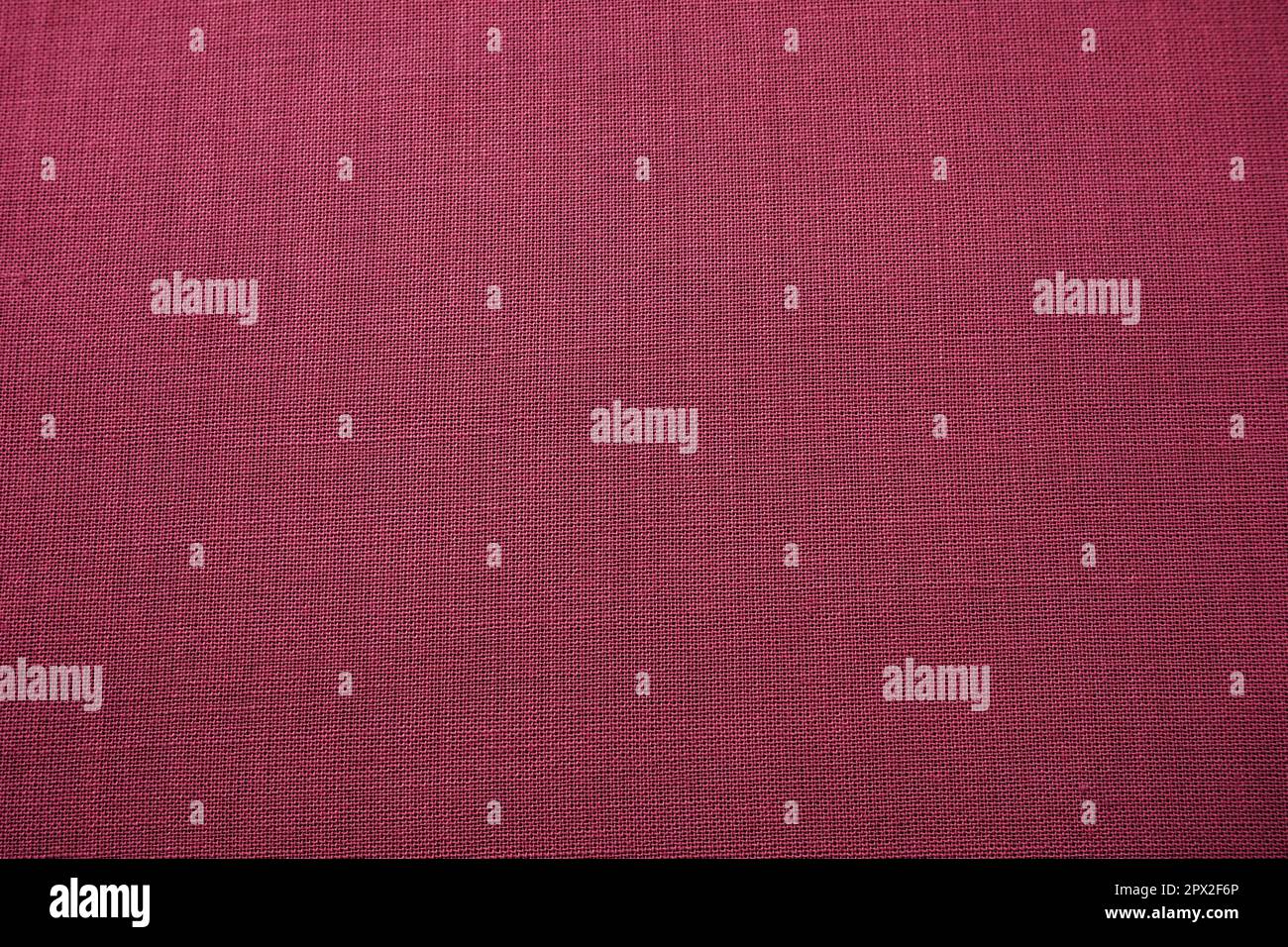 red, burgundy background fabric texture. A piece of woolen cloth is ...