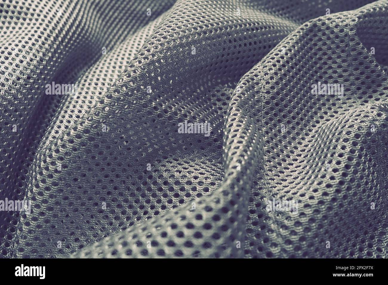 Synthetic fabric with holes laid in waves. Beautiful drape. Fabric for ...