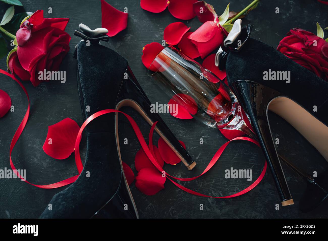 Romantic valentines day rendezvous with red roses and black stilettos ...